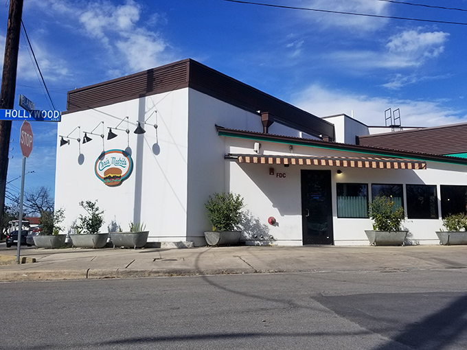 Colorful papel picado banners welcome you to burger paradise. The "Enter Here" sign might as well say "Abandon Diet All Ye Who Enter."