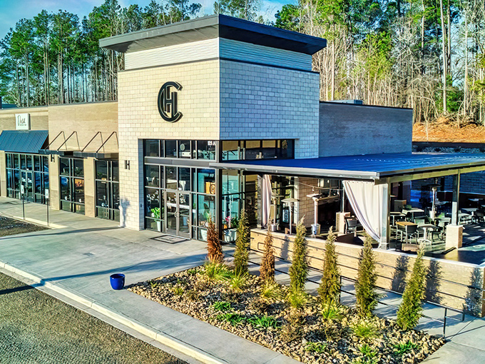 Modern elegance meets small-town charm at Chophouse of Chapin's striking exterior. The sleek design and signature "CH" logo promise culinary adventures await inside.