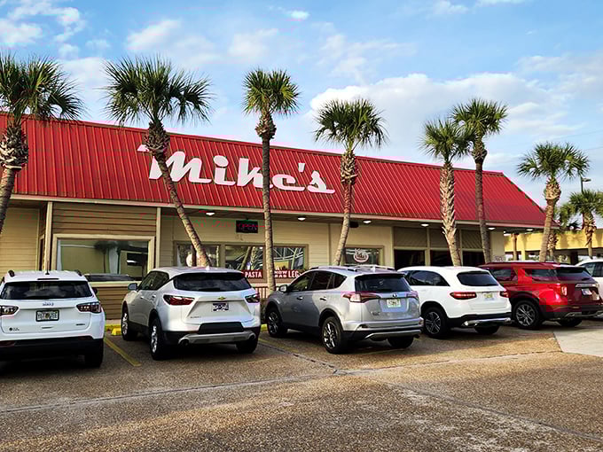 Mike's iconic red roof stands out like a culinary lighthouse, beckoning hungry travelers with the promise of seafood treasures within.