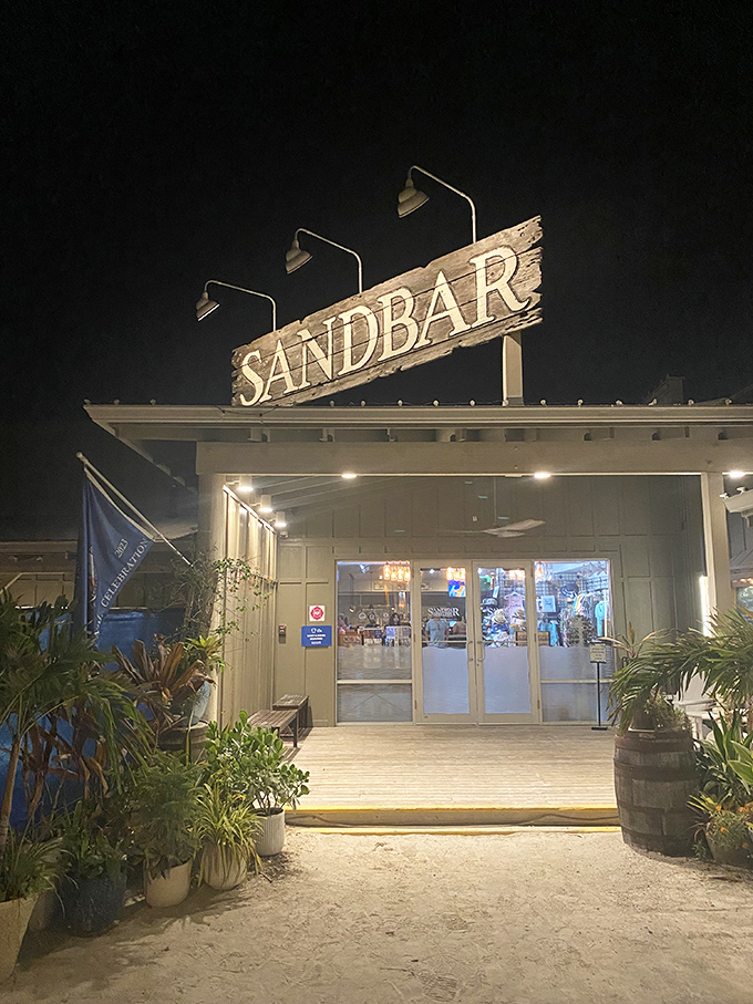 The Sandbar's illuminated sign welcomes night owls and sunset-chasers alike. Florida's coastal magic begins at these doors.