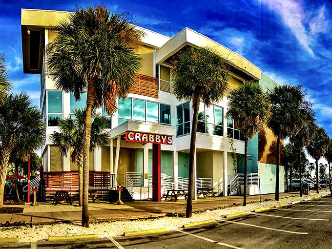Modern coastal architecture meets Florida sunshine at Crabby's Dockside. The palm trees aren't just for show&mdash;they're nature's way of saying "vacation starts here."