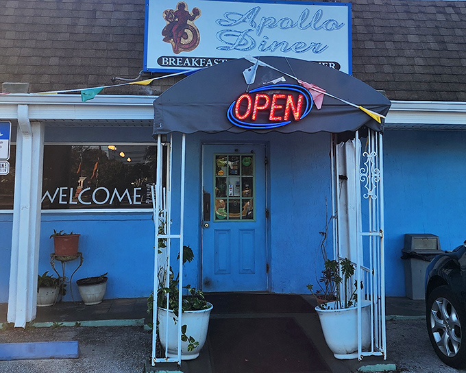 The bright blue exterior of Apollo Diner stands out like a culinary beacon in Melbourne, welcoming hungry travelers with its no-frills charm.