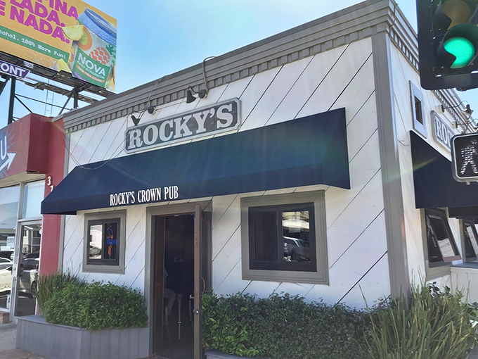 The unassuming exterior of Rocky's Crown Pub hides San Diego's burger royalty behind a modest blue awning. Culinary treasures often come in humble packages.