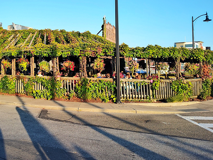 Nature's own decorator has transformed this waterfront gem into a living greenhouse. The vine-covered patio practically whispers "come sit awhile" to passersby.