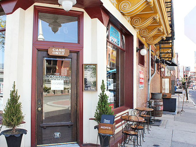 Step through this burgundy-trimmed doorway and prepare to time travel. The "CASH ONLY" sign is your first clue that authenticity trumps convenience here.