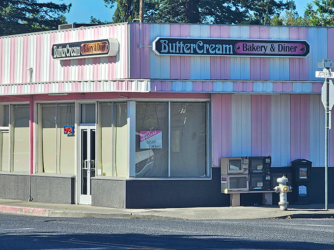 The pink-and-white striped exterior of Butter Cream isn't just a building&mdash;it's a promise of nostalgic delights waiting inside. Like a dessert come to life!