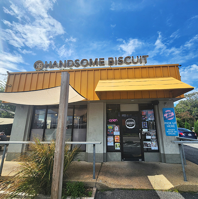 The bright orange exterior of Handsome Biscuit stands out like a culinary lighthouse, beckoning hungry travelers to the shores of breakfast bliss.