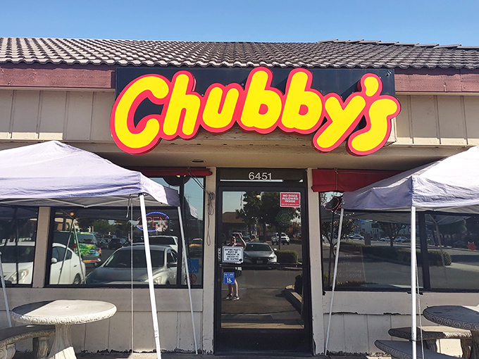 That iconic yellow sign beckons like a lighthouse for hungry travelers on Blackstone Avenue. Chubby's promises comfort before you even walk through the door.
