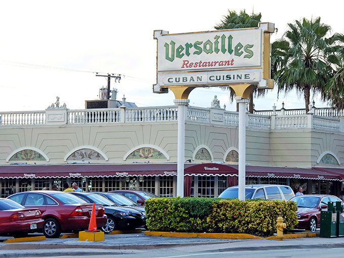 The iconic green-lettered sign of Versailles Restaurant stands proudly above its white fa&ccedil;ade, a beacon of Cuban culinary tradition in Miami's Little Havana.
