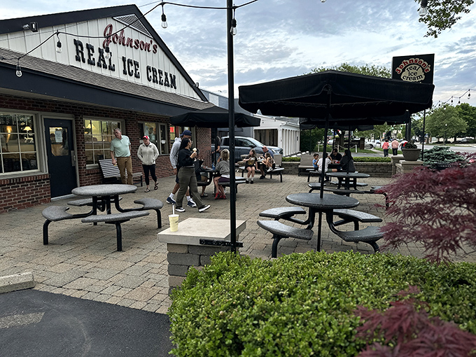 The classic white-gabled facade of Johnson's beckons like an ice cream lighthouse, guiding sweet-toothed pilgrims to their creamy destination since 1950.