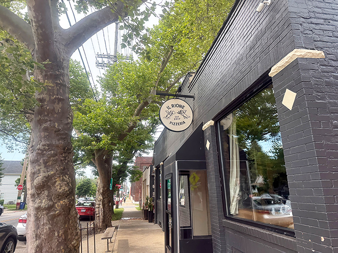 Il Rione's unassuming black exterior hides a pizza paradise within, like finding a secret speakeasy for your taste buds.