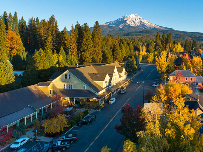 Mount Shasta stands sentinel over McCloud's historic downtown, where fall foliage frames buildings that have witnessed a century of small-town stories.