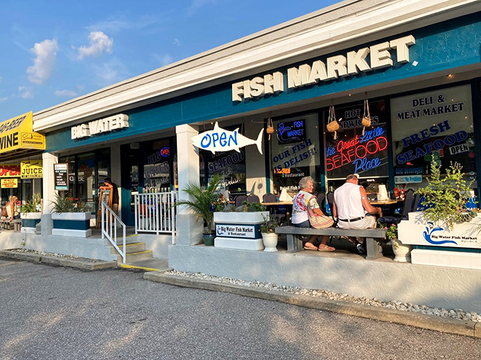 The teal storefront beckons like a siren call to seafood lovers. This unassuming strip mall gem houses treasures fresher than your uncle's retirement jokes.