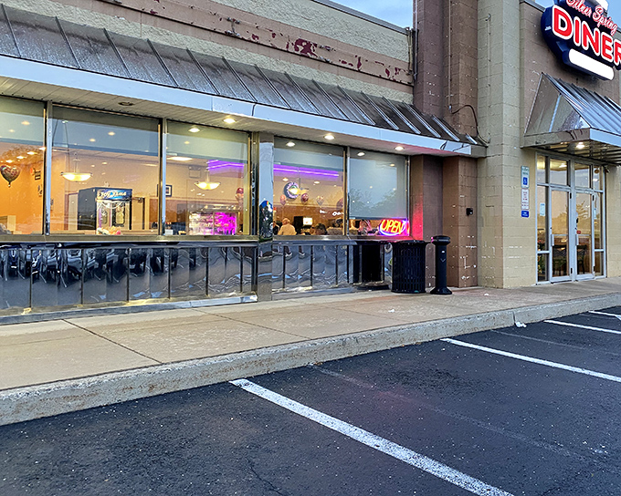 The neon glow of Silver Spring Diner beckons hungry travelers like a lighthouse for the breakfast-starved. Classic diner architecture with modern touches creates an irresistible roadside charm.