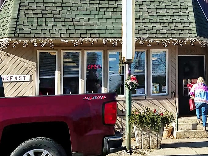 The unassuming exterior of Hometown Hot Dogs proves once again that culinary treasures often hide behind the most modest facades. Christmas lights in July? Why not!