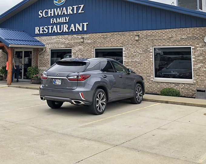 The blue-roofed beacon of Schwartz Family Restaurant stands proudly in Eckerty, promising comfort food worth the journey through Indiana's rolling countryside.