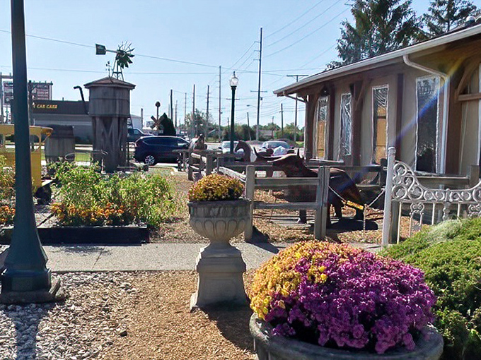 The iconic railroad crossing sign welcomes hungry travelers to Back 40 Junction, where Decatur's finest steaks await in this charming country-style building.