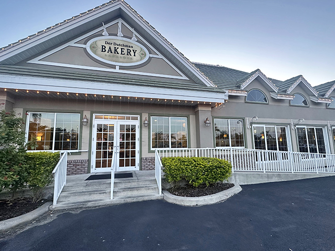 Der Dutchman's welcoming exterior promises comfort food paradise with its distinctive green roof and inviting front porch&mdash;architectural amuse-bouche for the feast within.