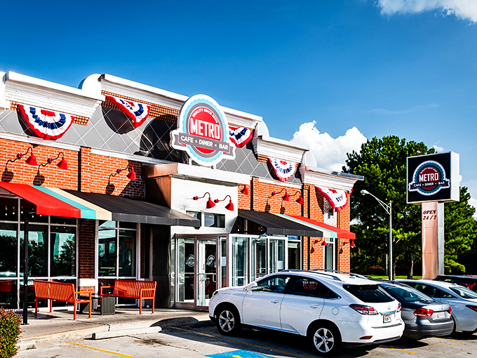 The iconic red and white exterior of Metro Cafe Diner stands like a beacon of comfort food against Stone Mountain's blue sky.