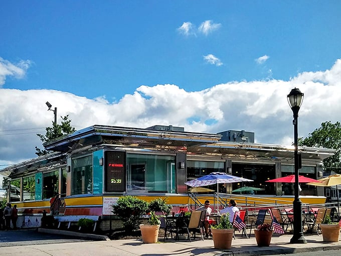 The classic chrome-and-glass exterior of The American Diner gleams in the Pennsylvania sunshine, a beacon for hungry travelers and locals alike.