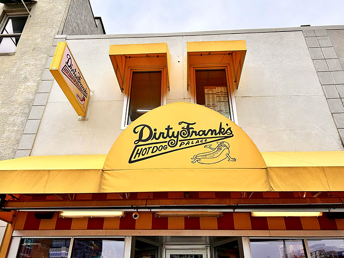 That sunshine-yellow awning isn't just a color choice&mdash;it's a promise of the cheerful culinary adventure waiting inside Dirty Frank's.