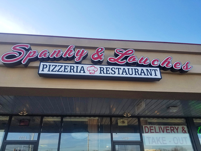 The unassuming storefront beckons with its neon-pink sign, promising Italian delights that far exceed its strip mall location's modest appearance.