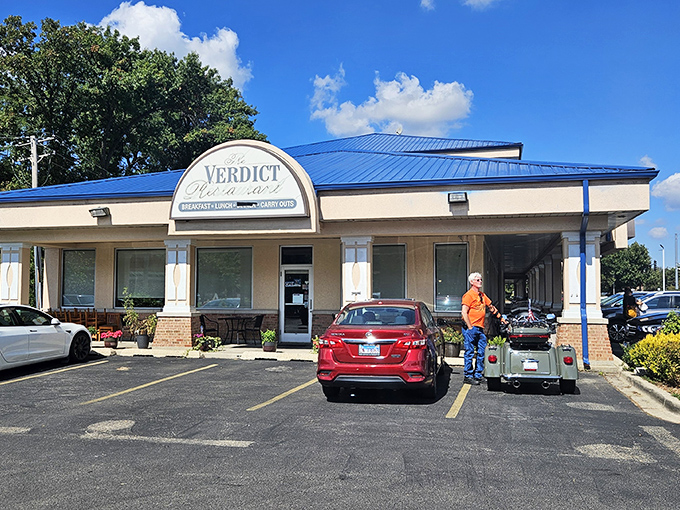 The distinctive blue roof of Verdict Restaurant stands out like a beacon for breakfast lovers in Wheaton's strip mall landscape.
