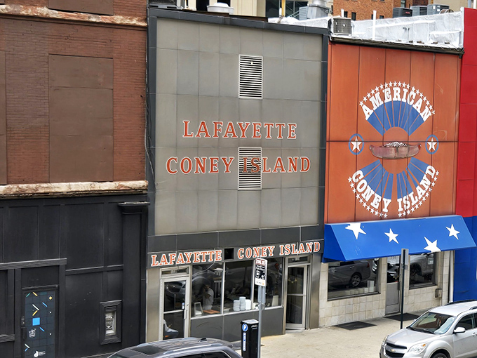 The iconic facade of Lafayette Coney Island stands proudly next to its rival, American. Detroit's culinary cold war continues deliciously on this corner.
