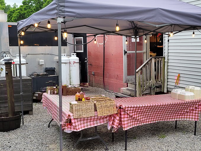 The outdoor setup at Eli's BBQ feels like stumbling upon a backyard cookout where everyone's invited. Those string lights aren't just for show&mdash;they're beacons guiding hungry souls home.