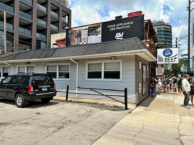 The unassuming white exterior of Mr. Beef stands like a culinary time capsule amid River North's modern development, a beacon for sandwich pilgrims.