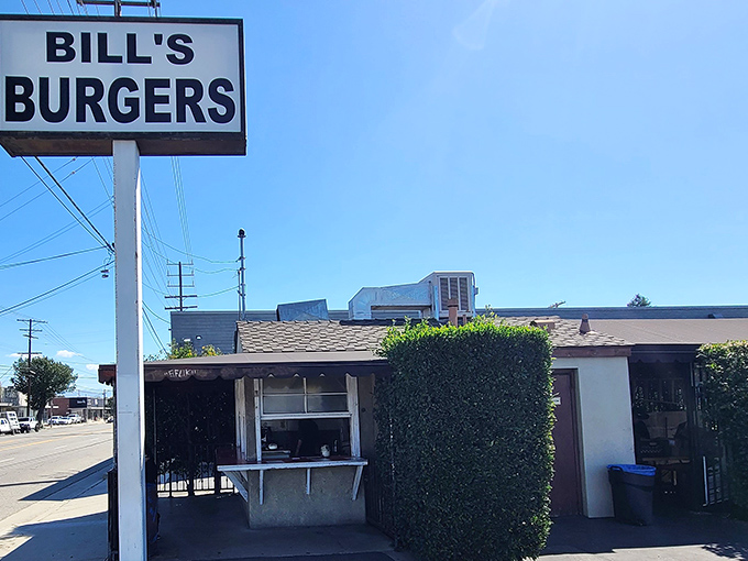The unassuming exterior of Bill's Burgers stands as a time capsule of old California, where culinary treasures hide in plain sight.