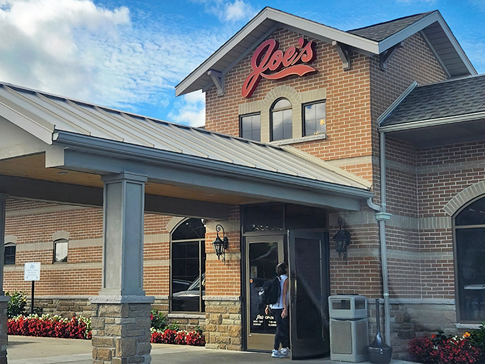 That red script sign might as well say "happiness lives here" &ndash; and it wouldn't be lying.