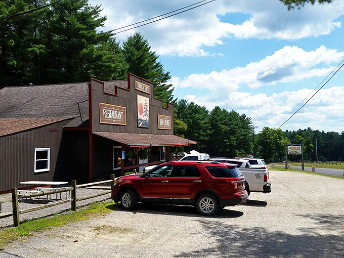 The frontier-style facade of Trail's End stands proudly among towering pines, like a delicious mirage appearing just when your hunger hits its peak.