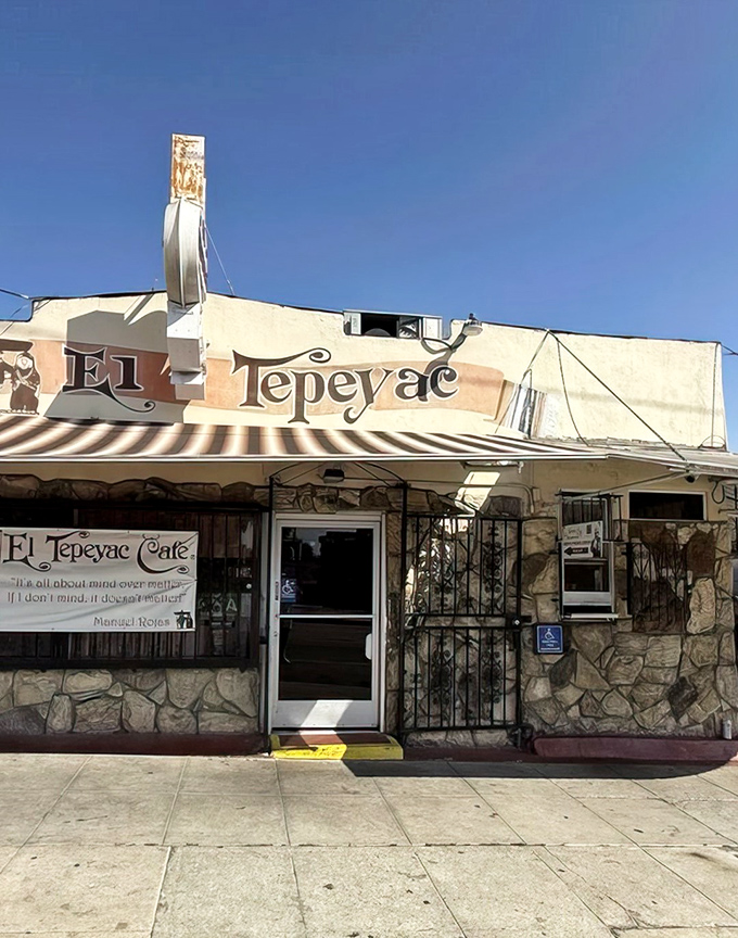 The unassuming stone facade of El Tepeyac Cafe stands like a culinary fortress in Boyle Heights, promising authentic Mexican treasures within those humble walls.