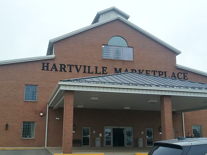 The iconic barn-inspired exterior of Hartville MarketPlace welcomes treasure hunters with the promise of discoveries waiting inside. Ohio's retail wonderland stands ready.