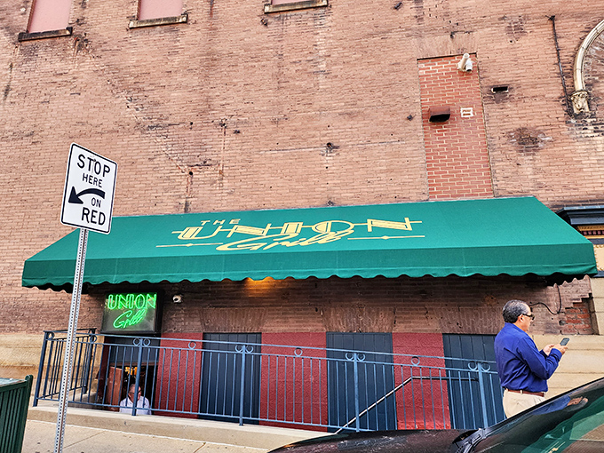 The iconic green awning and neon sign of Union Grill stand as a beacon for hungry travelers on Washington's Main Street. Small-town charm, big-time flavors await.