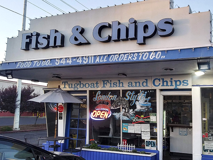 The unassuming storefront of Tugboat Fish & Chips might not stop traffic, but locals know this modest exterior hides seafood gold within.