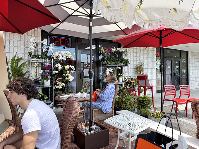 The Rooster's cheerful exterior with its vibrant red umbrellas is like a morning wake-up call that promises good things ahead.