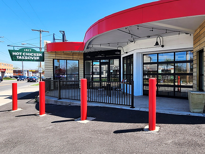 The bright red awning and distinctive green sign serve as a beacon for fried chicken pilgrims. This unassuming storefront houses Columbus' worst-kept culinary secret.