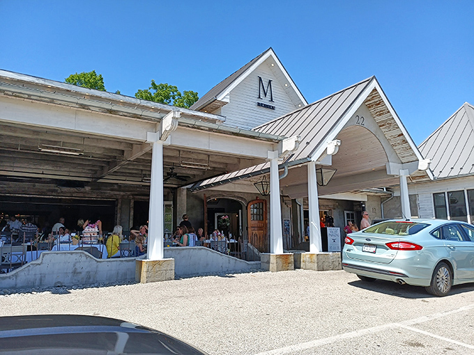 The charming white clapboard exterior of M Italian stands like a culinary lighthouse in Chagrin Falls, beckoning hungry travelers with its distinctive peaked roof.