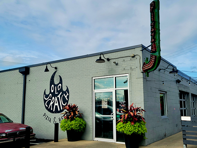 The unassuming gray exterior of Old Scratch Pizza belies the flavor revolution happening inside. Like a culinary speakeasy, it keeps its superpowers hidden in plain sight.