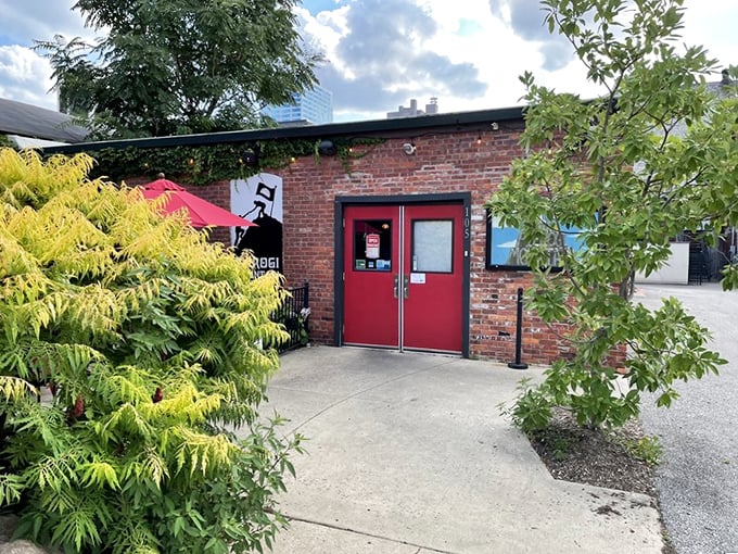 The unassuming brick exterior of Pierogi Mountain beckons with its vibrant red umbrellas and casual charm&mdash;proof that culinary treasures often hide in plain sight.