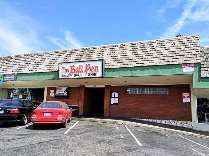 The unassuming exterior of The Bull Pen speaks volumes: great steakhouses don't need flashy facades when the meat inside does all the talking.