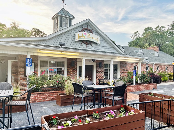 The welcoming facade of Judy Boone's, where vibrant flower boxes greet you before the aroma of Southern cooking does. Worth the drive from anywhere in South Carolina.