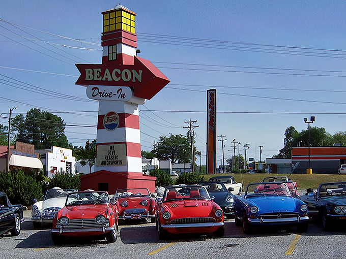 The iconic red awning and stone facade of The Beacon Drive-In stands as Spartanburg's culinary lighthouse, guiding hungry travelers to burger paradise.