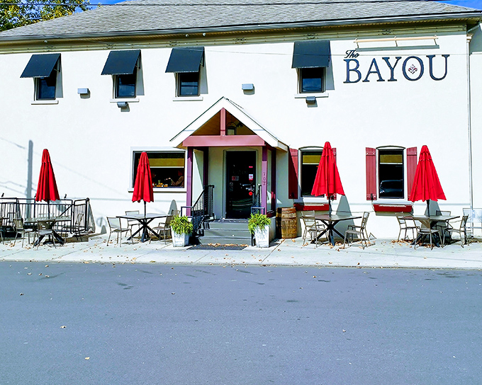 The unassuming white exterior of The Bayou might fool you, but those bright red umbrellas are practically waving "come eat something amazing" in semaphore.