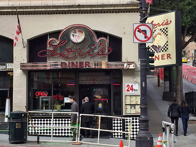The iconic neon sign of Lori's Diner glows like a beacon of nostalgia on Powell Street, promising comfort food and a trip back in time.
