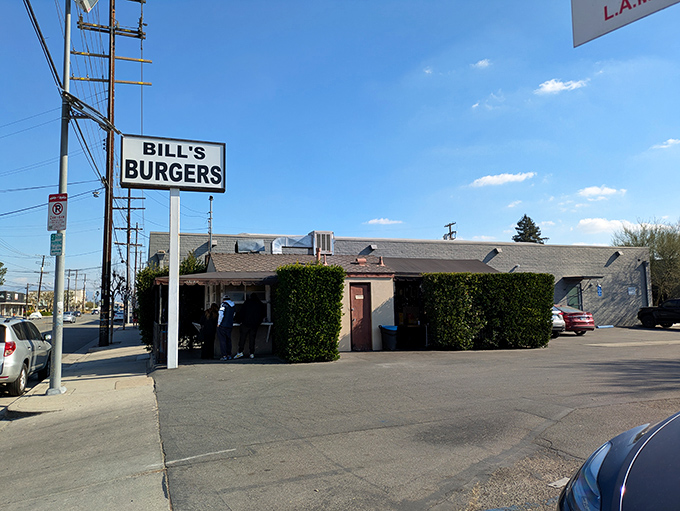 The unassuming exterior of Bill's Burgers stands as a testament to the timeless truth: never judge a burger joint by its facade.