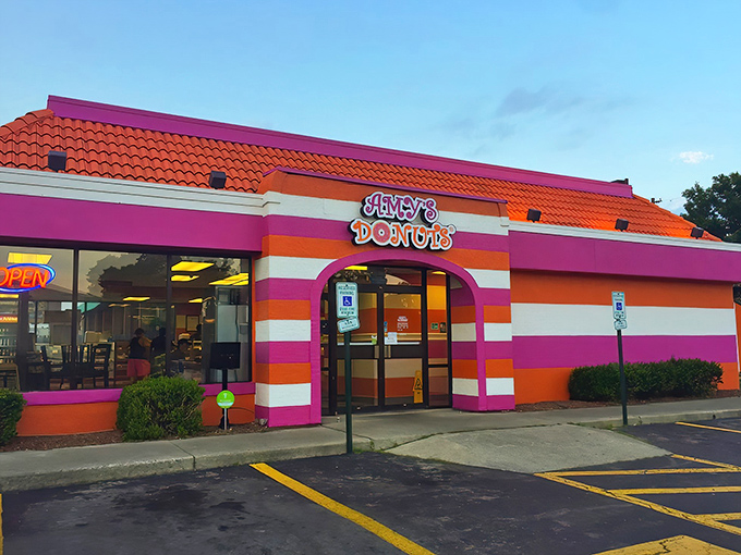Those pink and orange stripes aren't just eye-catching – they're a beacon calling all donut lovers home.