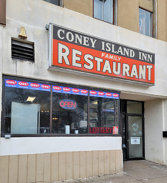 The vintage sign beckons like an old friend. Coney Island Inn's unassuming storefront hides culinary treasures that locals have cherished for generations.